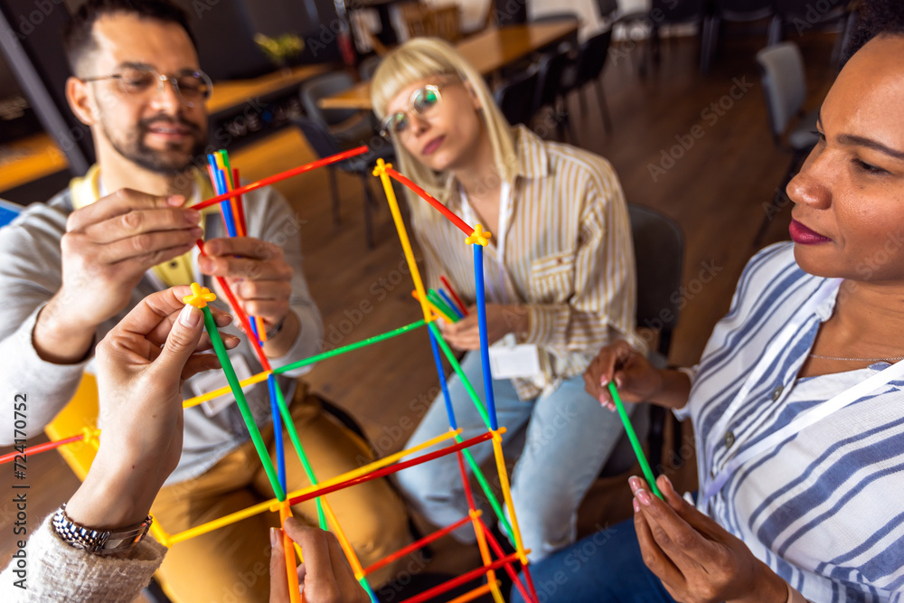 Team building activities in the office with sticks.Concept of ...