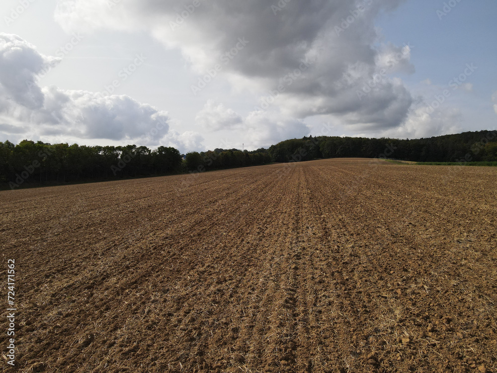 Agriculture land with brown soil in the countryside Stock Photo | Adobe ...