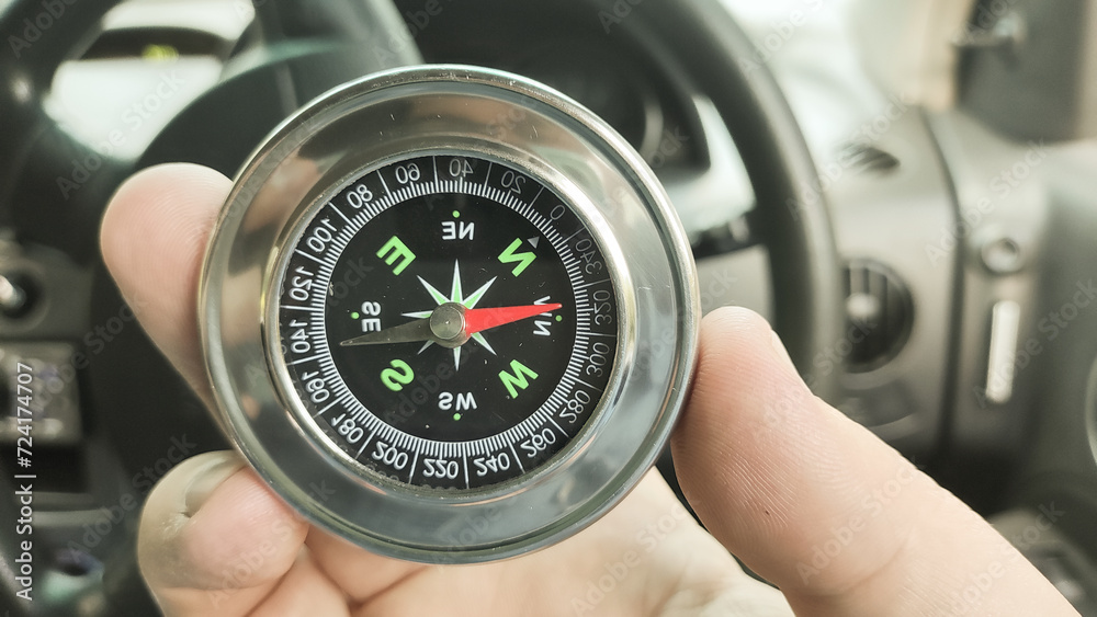 metal compass in hand. silver antique compass.retro compass. terrain ...