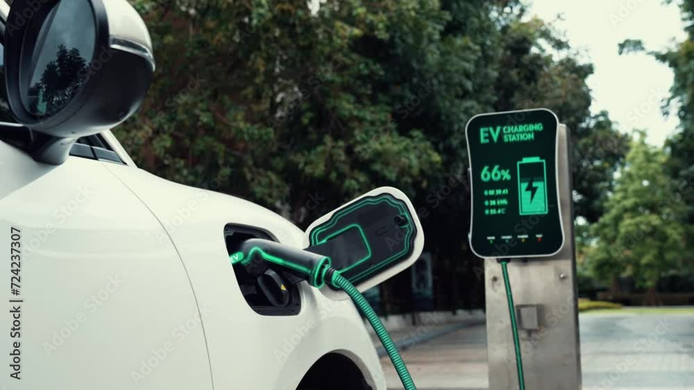 Electric car recharging battery by futuristic smart EV charger from eco ...