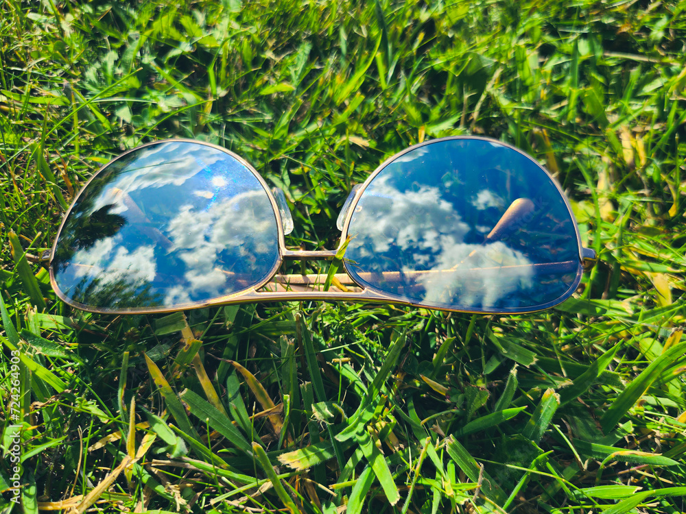 Stylish aviator sunglasses with mirrored lenses perfectly reflect the ...