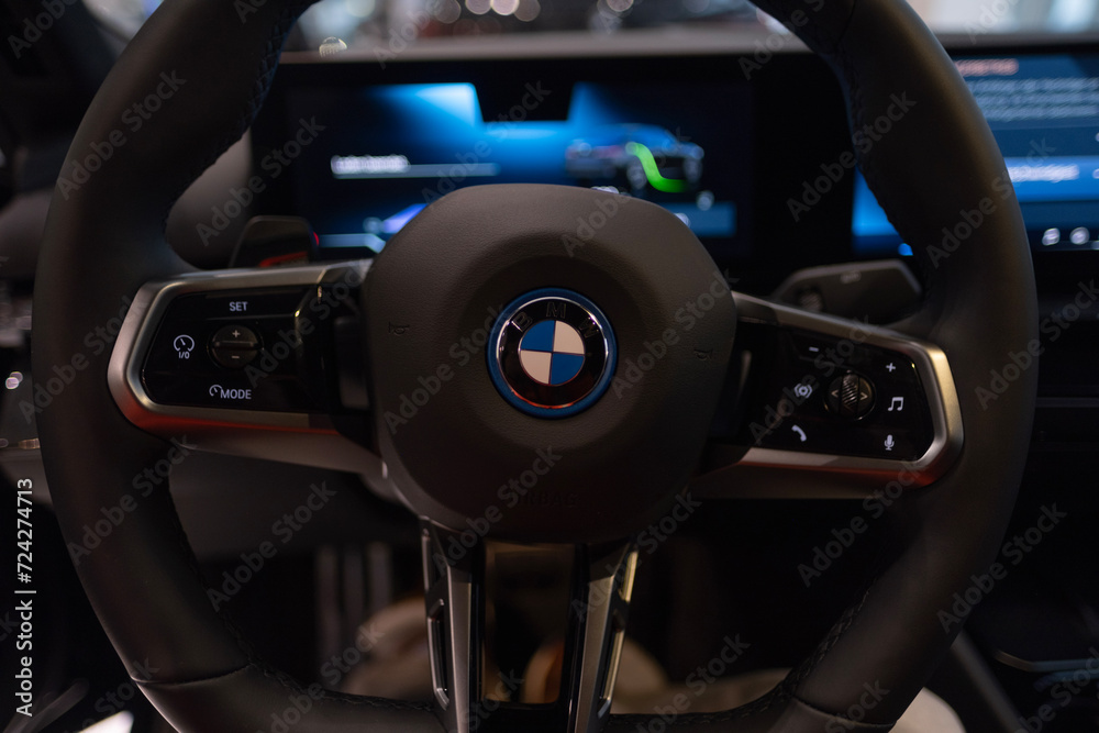 Interior, cockpit of BMW i5 eDrive40 car, digital panel, close-up Logo ...