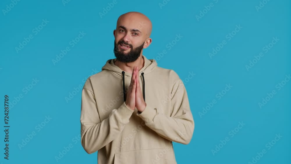 Middle eastern man praying to Allah for forgiveness, being religious ...