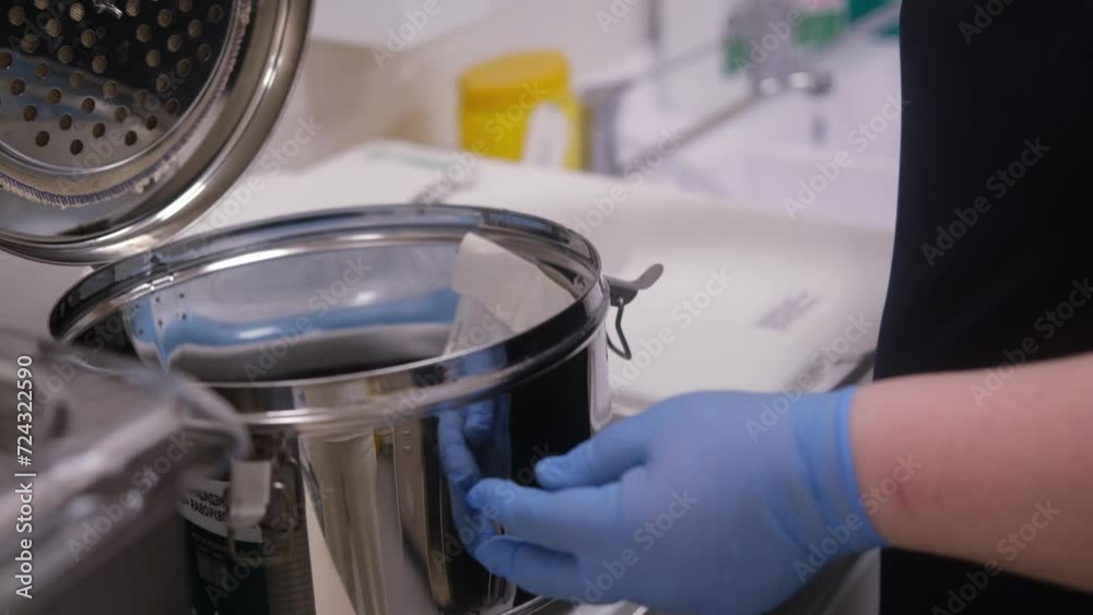 Vidéo Stock Laboratory female worker packing up medical instruments and ...