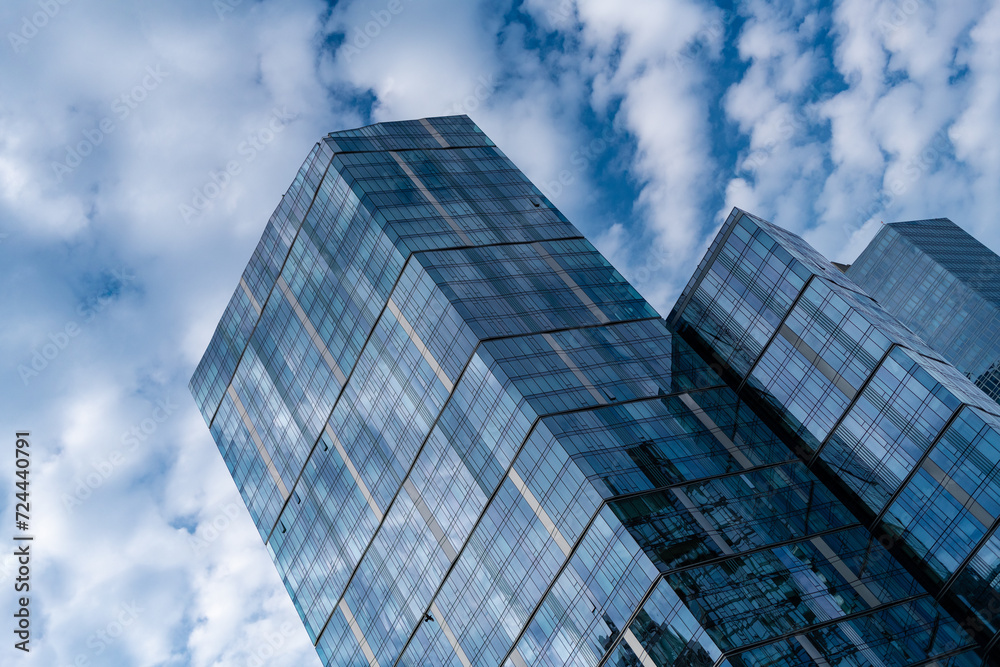 Skyscraper with glassy facade building in metropolis city downtown in ...
