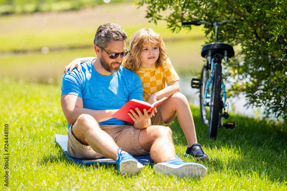 Dad and child reading book together. child son learning with dad ...
