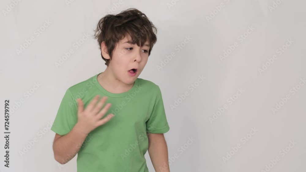 Boy with a cough, potentially from allergies or a common cold, showing ...