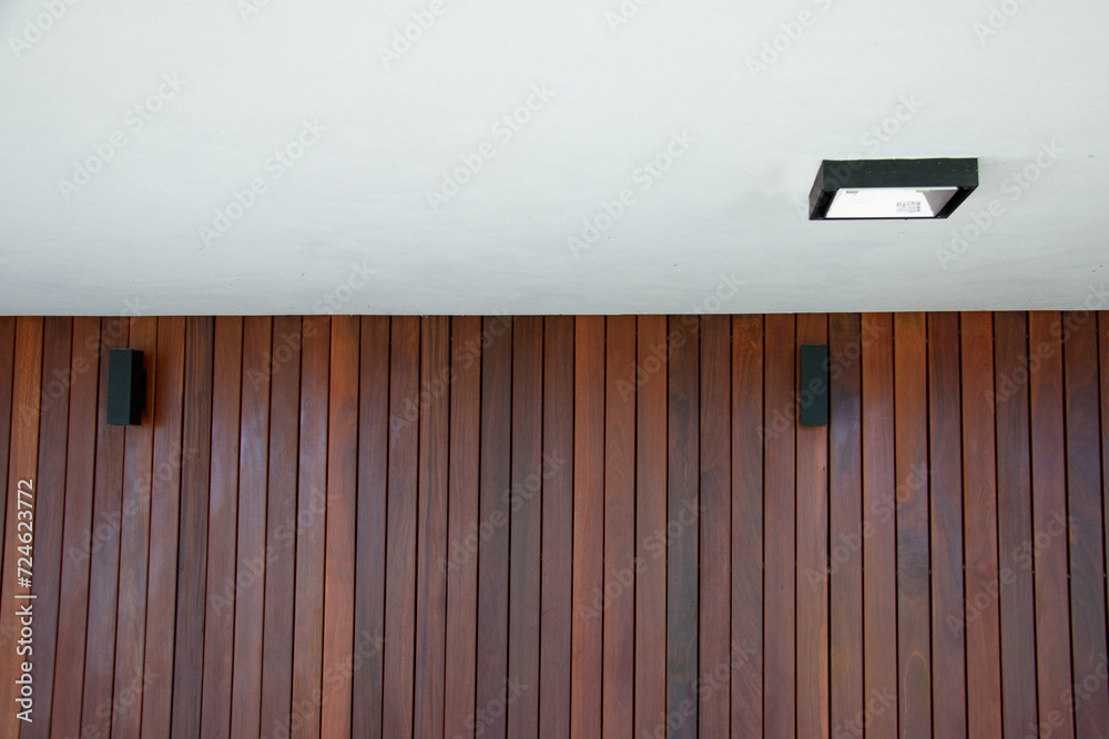 Ipe interior wall cladding and white ceiling light empty space for text ...