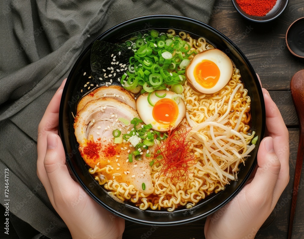 Bird s eye view of hands cradling a bowl of Japanese ramen Stock Photo ...