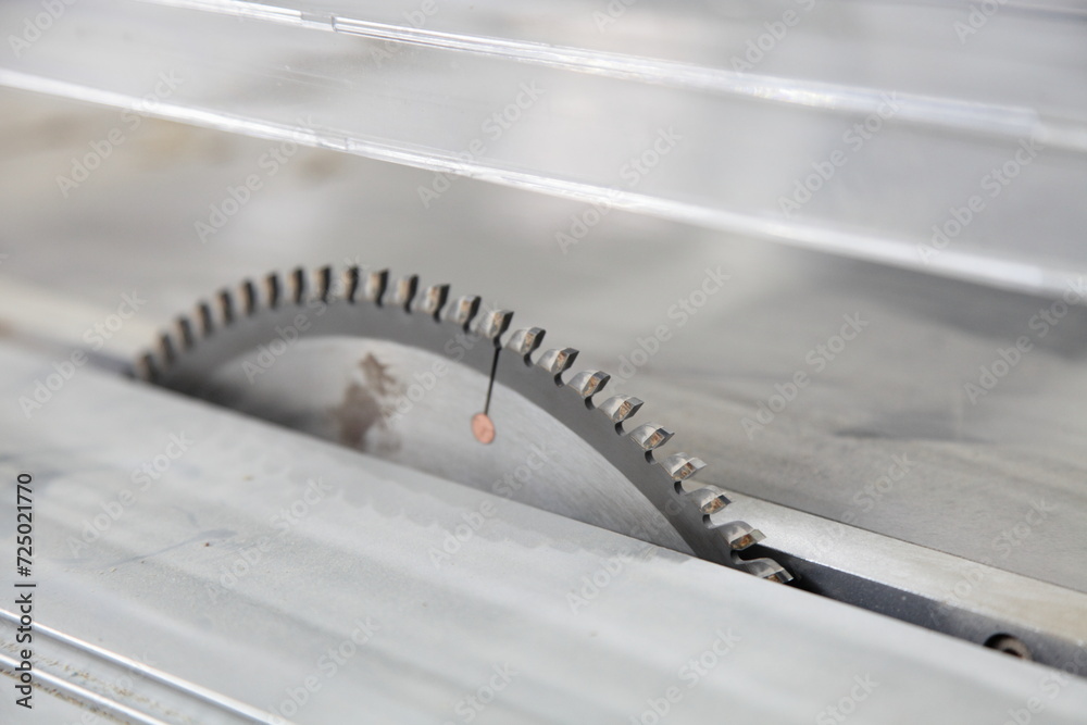 Circular disk saw Wood cutter closeup with hardened cogs. A carpenter ...