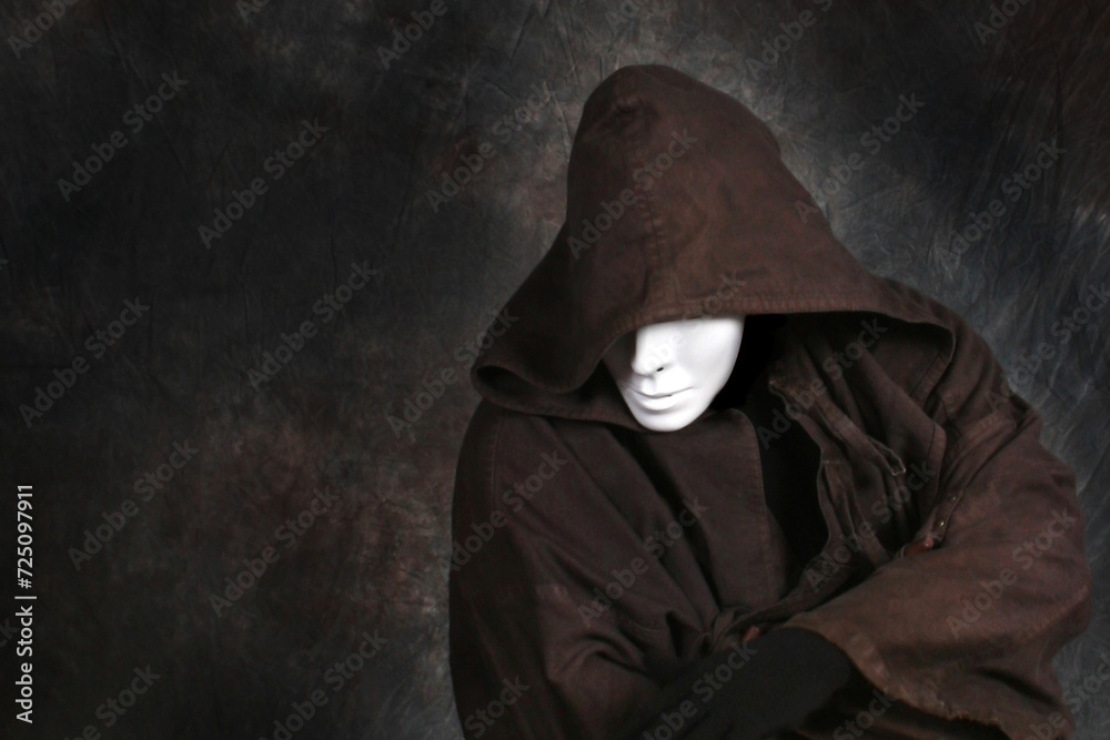 Horizontal photo of a faceless person (demon, monster) wearing a white ...