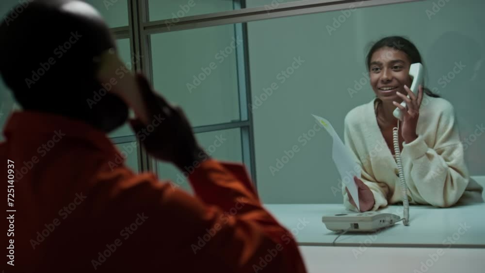 Young cheerful African American girl entering visiting room in prison ...