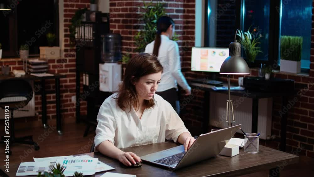 Businesswoman working overtime for company project, doing tasks in ...