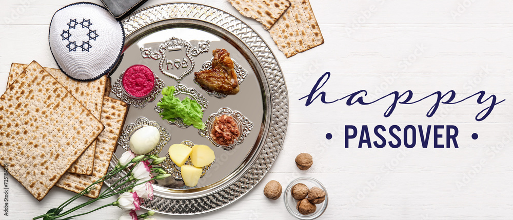 Passover Seder plate with traditional food and Jewish cap on table ...