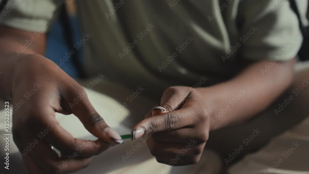 Close-up shot of hands of unrecognizable African American or Asian ...