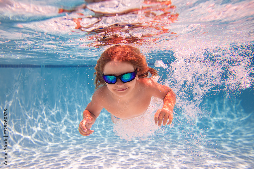 Child in swimming pool underwater. Kid underwater swim. Child splashing ...