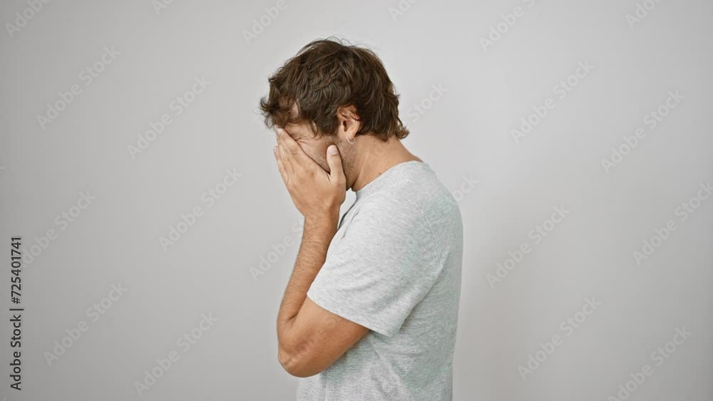 Confused young man crying, sadness engulfing his face as he tries ...