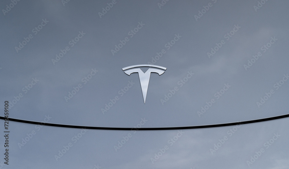 Tesla logo sign on the car bonnet. Electric vehicle hood or EV auto ...