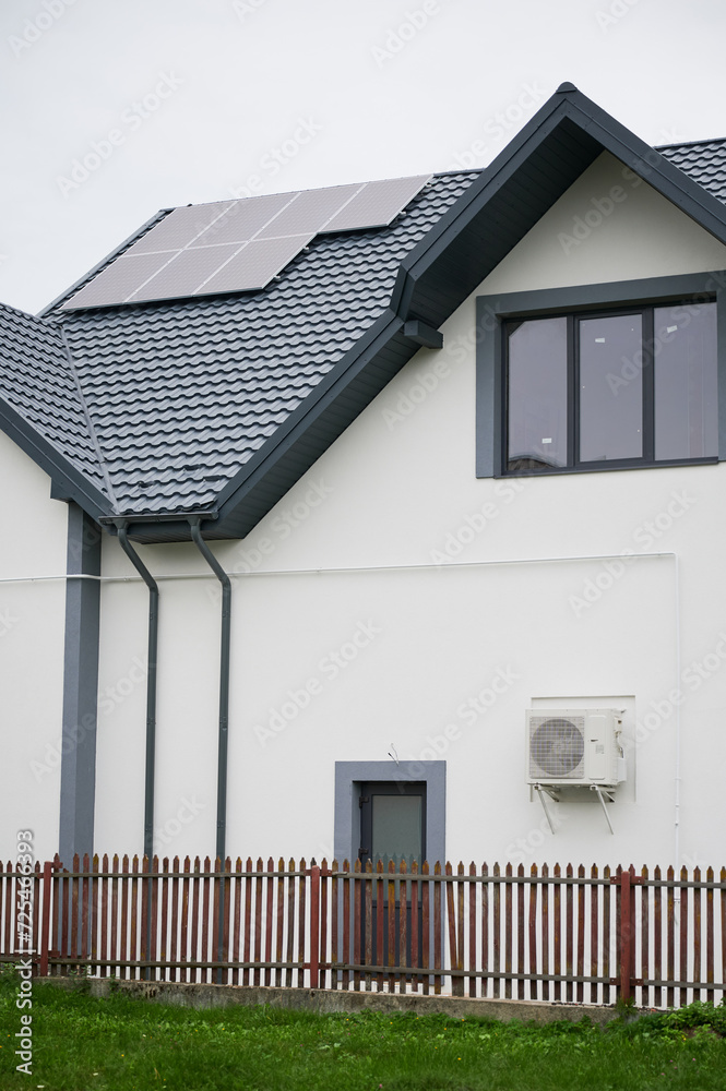 Bottom view of house with solar panels on roof. Photovoltaic solar ...