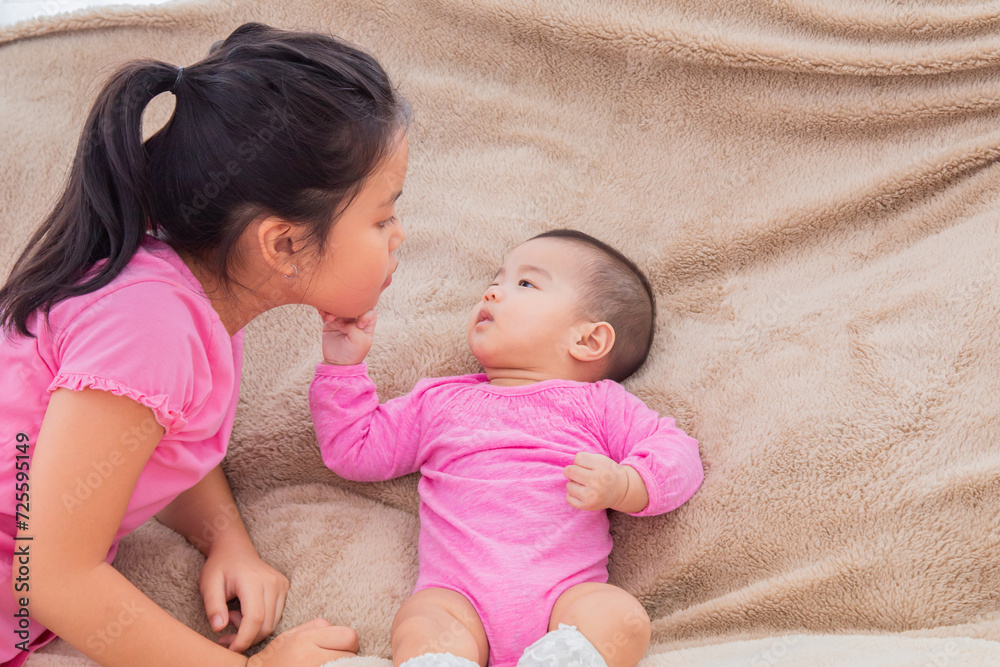 Asian sibling love bonding relationship, adorable girl playing with ...