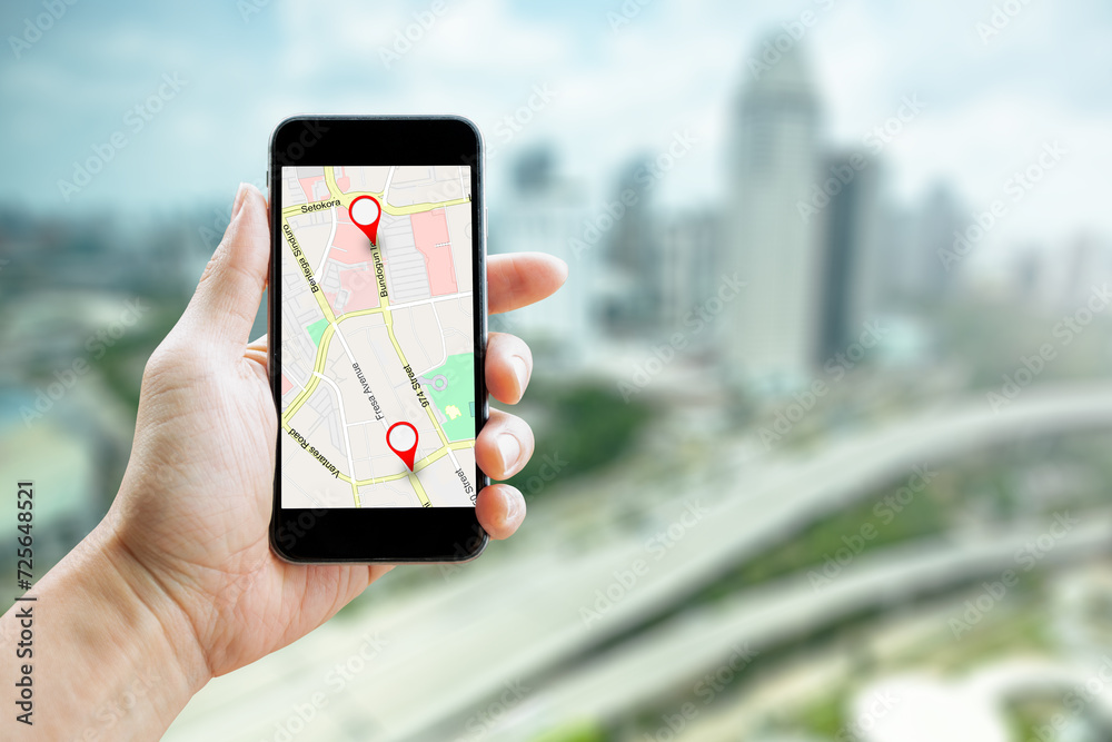 Man hand holding smartphone with GPS Map to Route Destination network ...