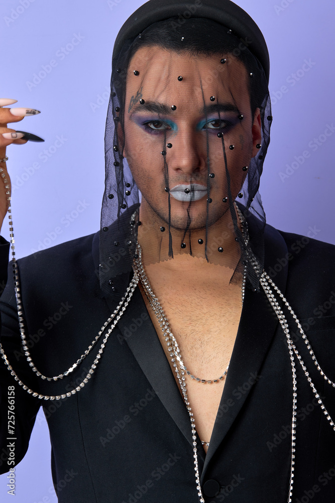 caucasian transgender male with translucent face cape posing at camera ...