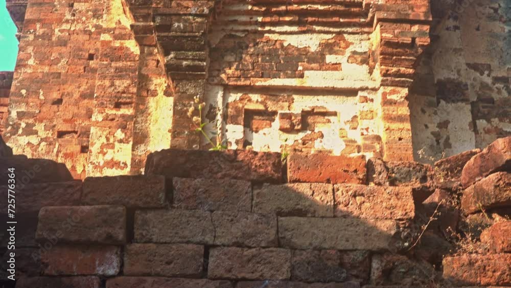 The ruins of an old castle built with laterite bricks of the ancient ...