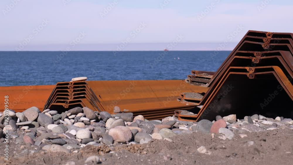 Metal Larsen sheet piles or Larsen piles stacked in stack. Sheet piles ...