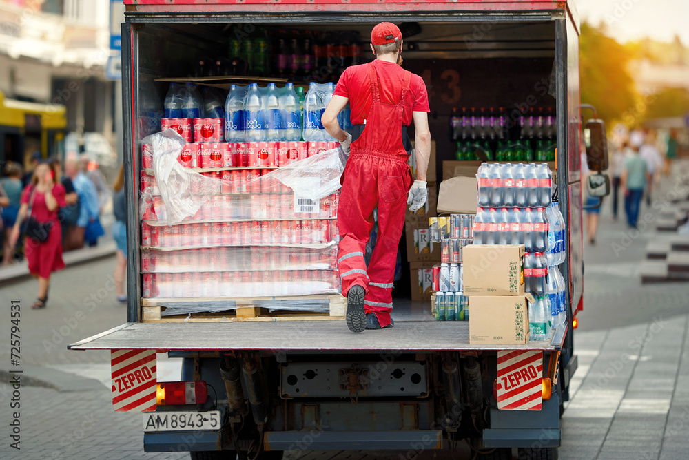 Minsk, Belarus. Jul 5, 2023. Coca Cola delivery man unloading truck ...