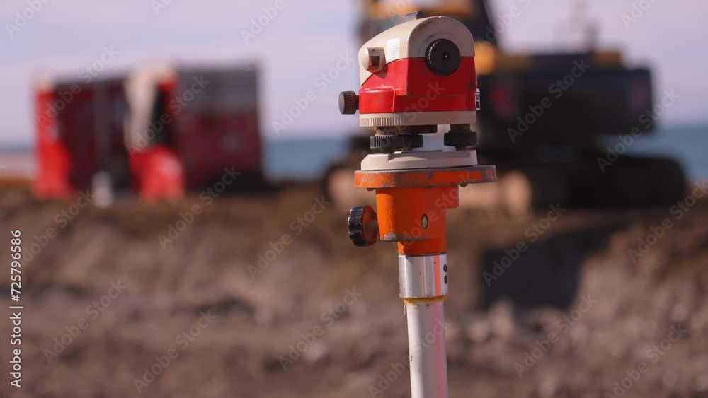 Close-up image of optical level or surveying instrument used to measure ...