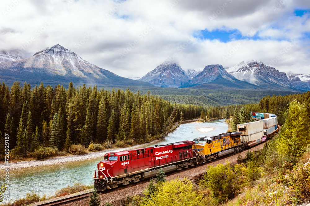 Morant's curve with cargo train passing, Banff National Park, Alberta, Canada Stock Photo ...