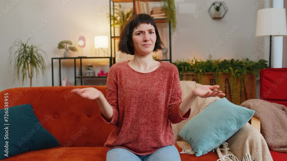 Confused woman raising hands asking why, what reason of failure ...