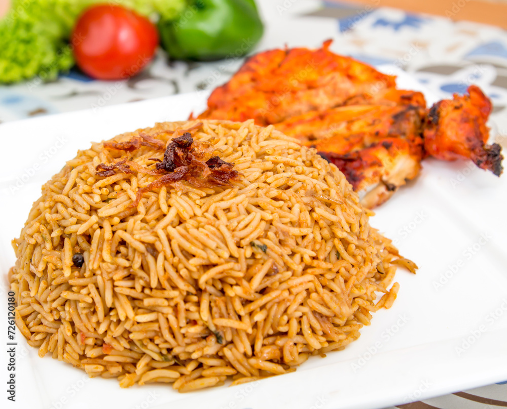 Chicken Bukhari mandi biryani rce pilaf with fried onion served in dish ...