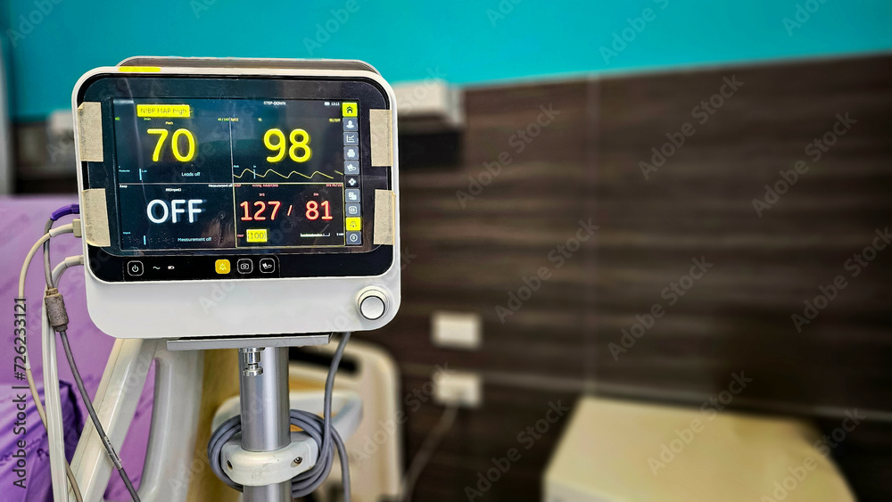 Vital signs monitor showing Heart rate and blood pressure of patient in ...