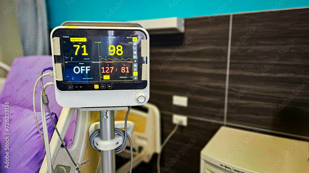 Vital signs monitor showing Heart rate and blood pressure of patient in ...