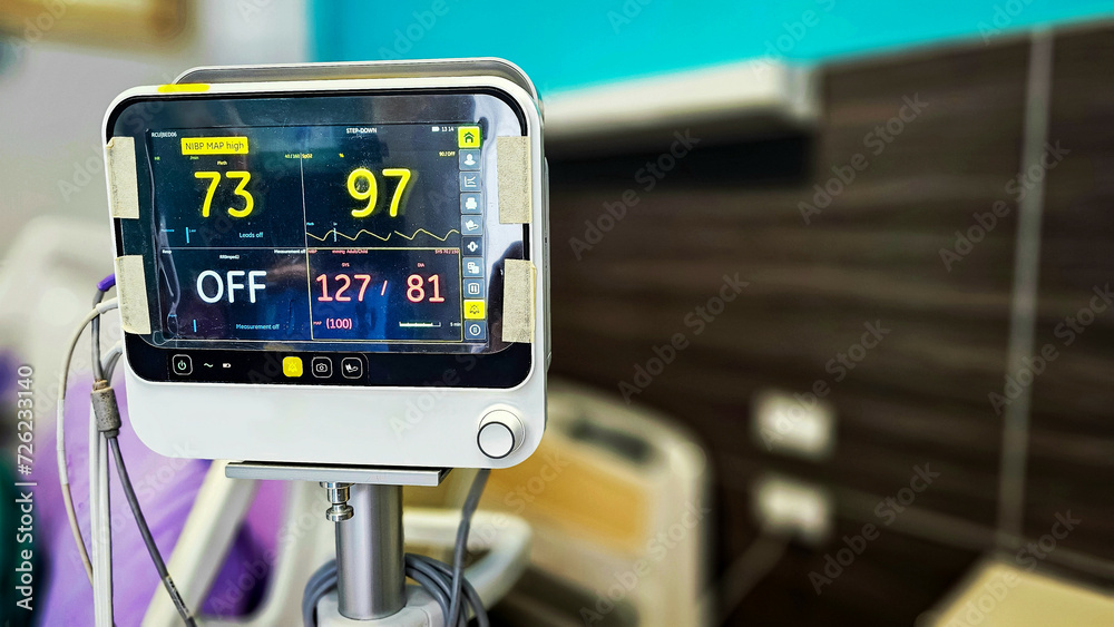 Vital signs monitor showing Heart rate and blood pressure of patient in ...