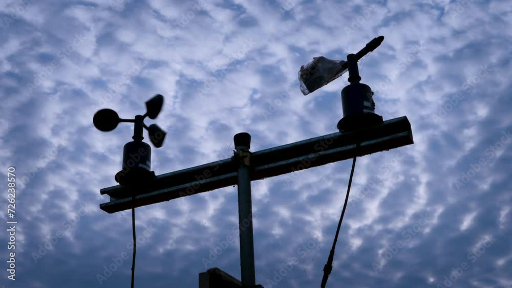 Silhouette of anemometer cup on cloudy sky background, old and rusty ...