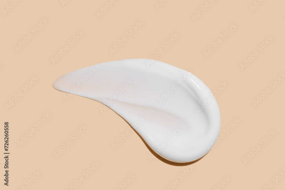 Cosmetic product smear white moisturizing lotion isolated on beige ...