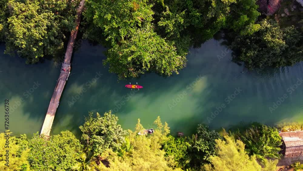 top view of a couple in a kayak in the jungle of Koh Chang Island ...