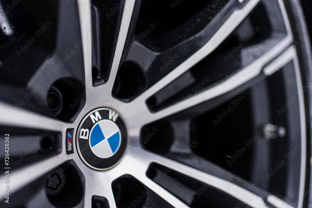 BMW logo and M shield on the aluminum rim of a BMW M8, close-up ...