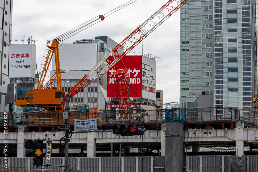 Tokyo, Japan, 29 October 2023: Construction cranes and signage at a ...