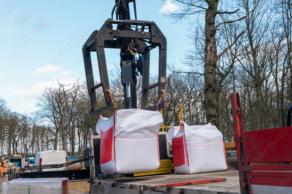 Dropside flatbed HIAB crane lorry with brick grab attachment deliver ...