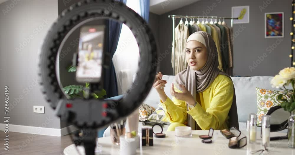 Female beauty blogger recording video. Top makeups, Muslim woman in ...