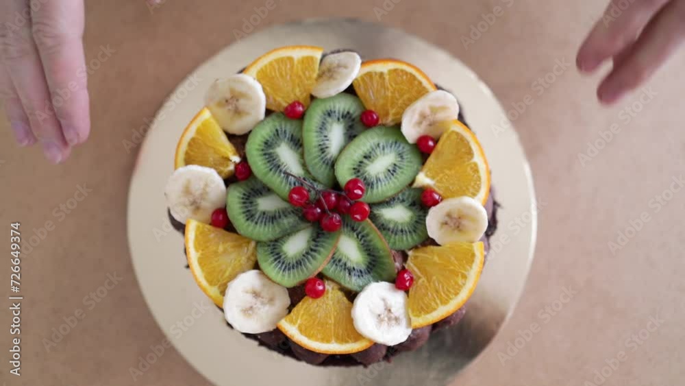 cook a cake in the kitchen. Young male pastry chef cooking a beautiful ...