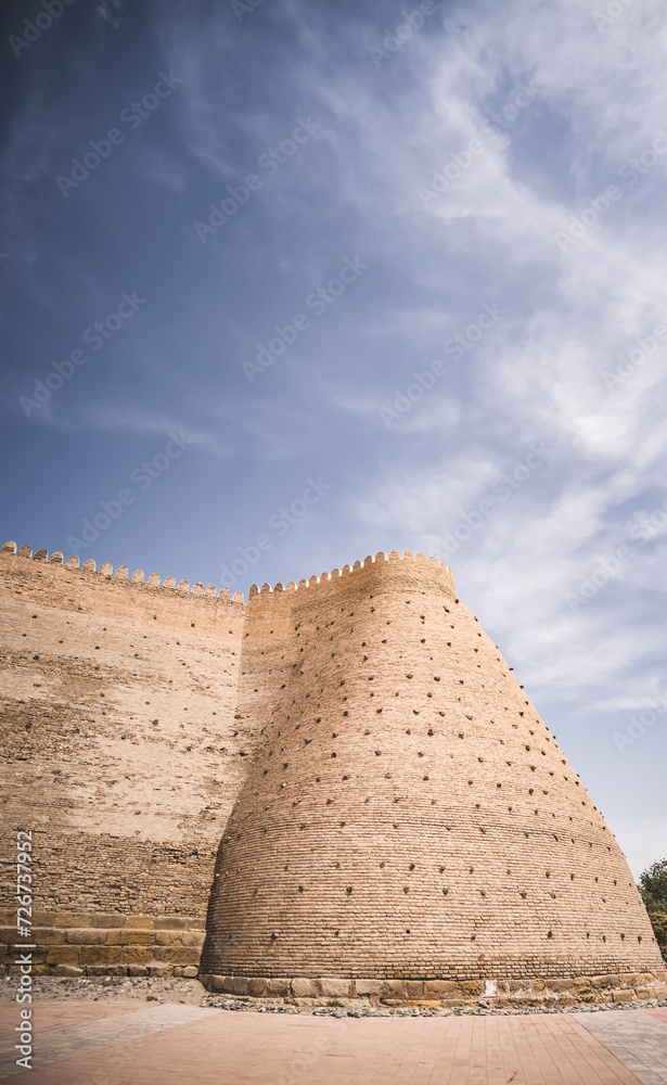 Ark Citadel with brick fortress walls in the ancient city of Bukhara in ...