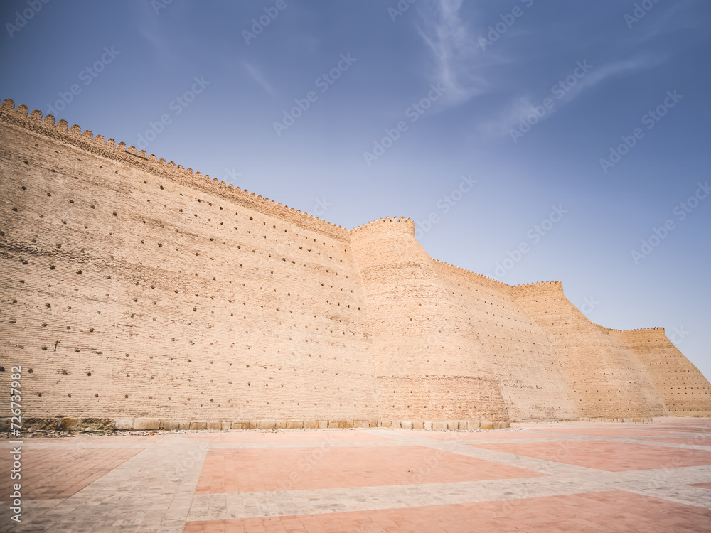 Ark Citadel with brick fortress walls in the ancient city of Bukhara in ...