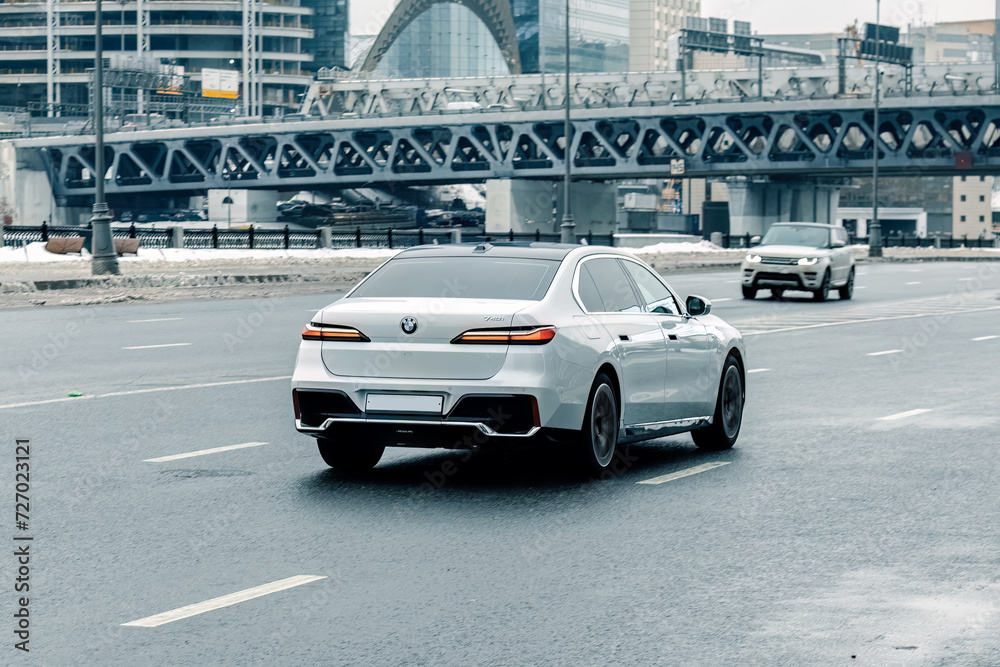BMW 7 Series 740i car in motion on urban road, rear side view Stock ...