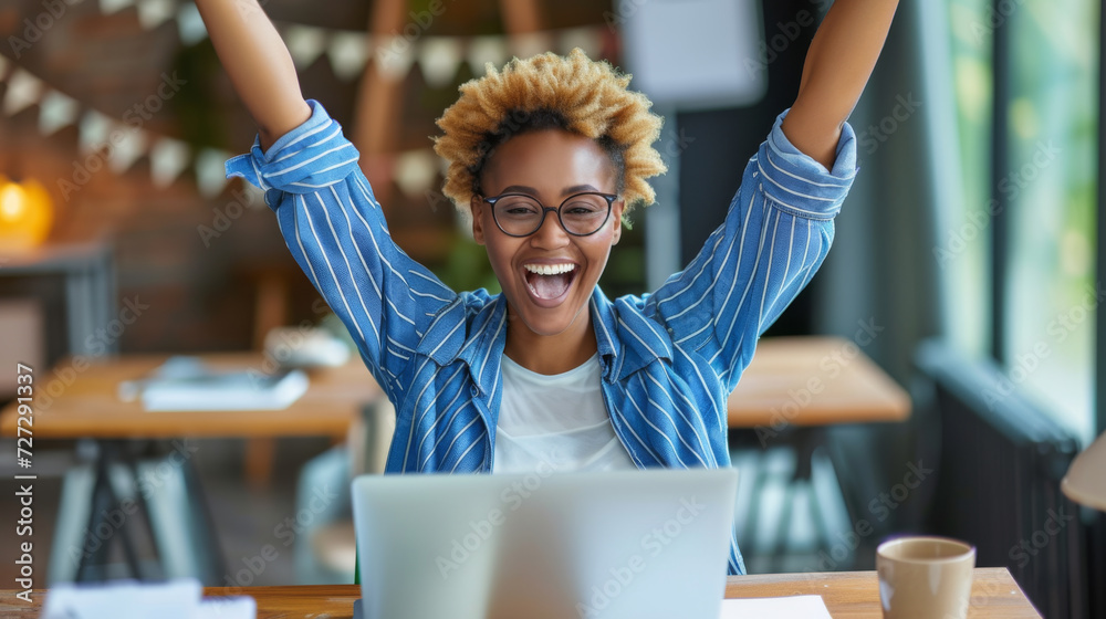 exuberant woman with tousled hair and glasses is raising her arms ...