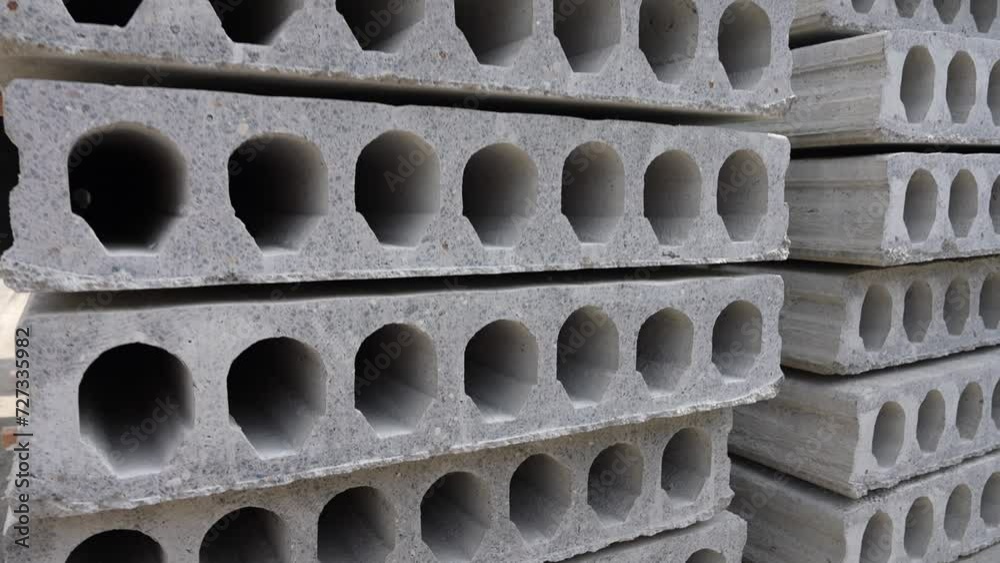 Stack of Prefabricated concrete slabs with hole for construction. Plant ...