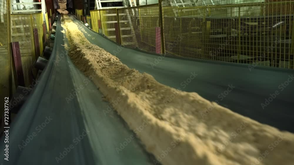 Industrial belt conveyor. Moving Raw Materials. Close-up shot of the ...